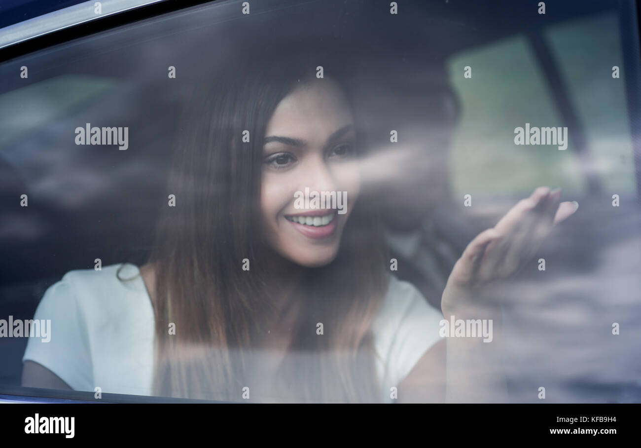 young woman portrait in the car behind the window Stock Photo - Alamy