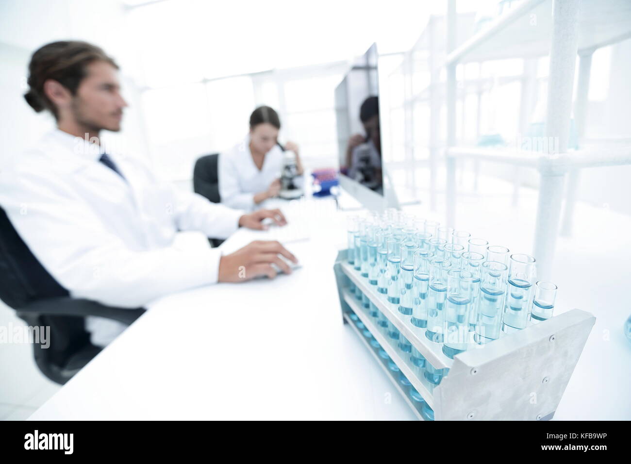 side view of scientists working in laboratory Stock Photo - Alamy