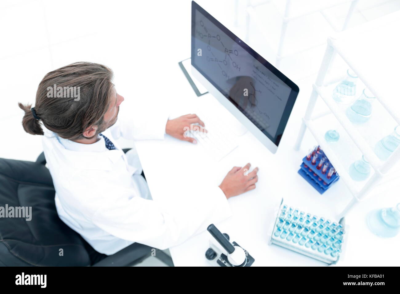 view from above of the scientist-doctor sitting on the computer Stock ...
