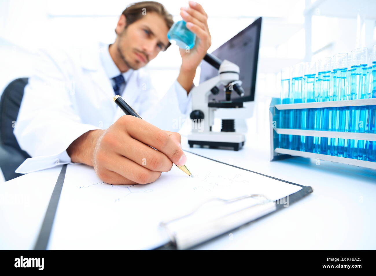 scientist analyzing an experiment in a laboratory Stock Photo - Alamy