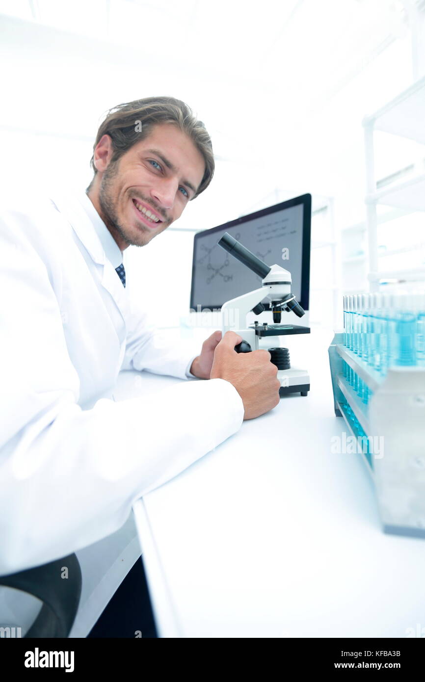 Student in biology using microscope in training class Stock Photo - Alamy