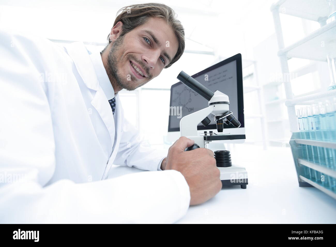Student in biology using microscope in training class Stock Photo - Alamy