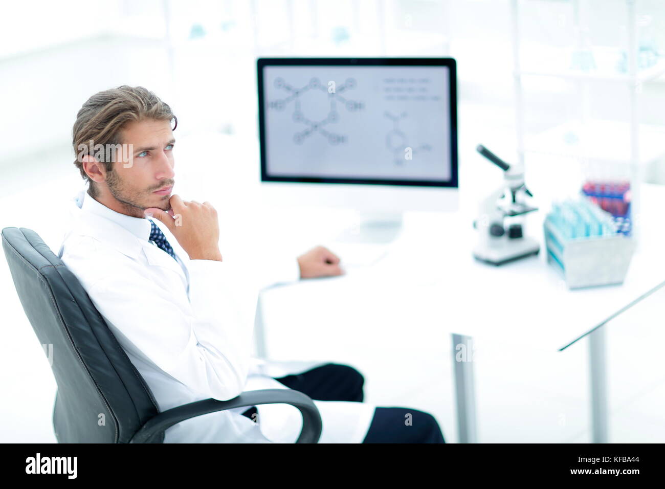 Scientist using computer and microscope in the laboratory Stock Photo ...