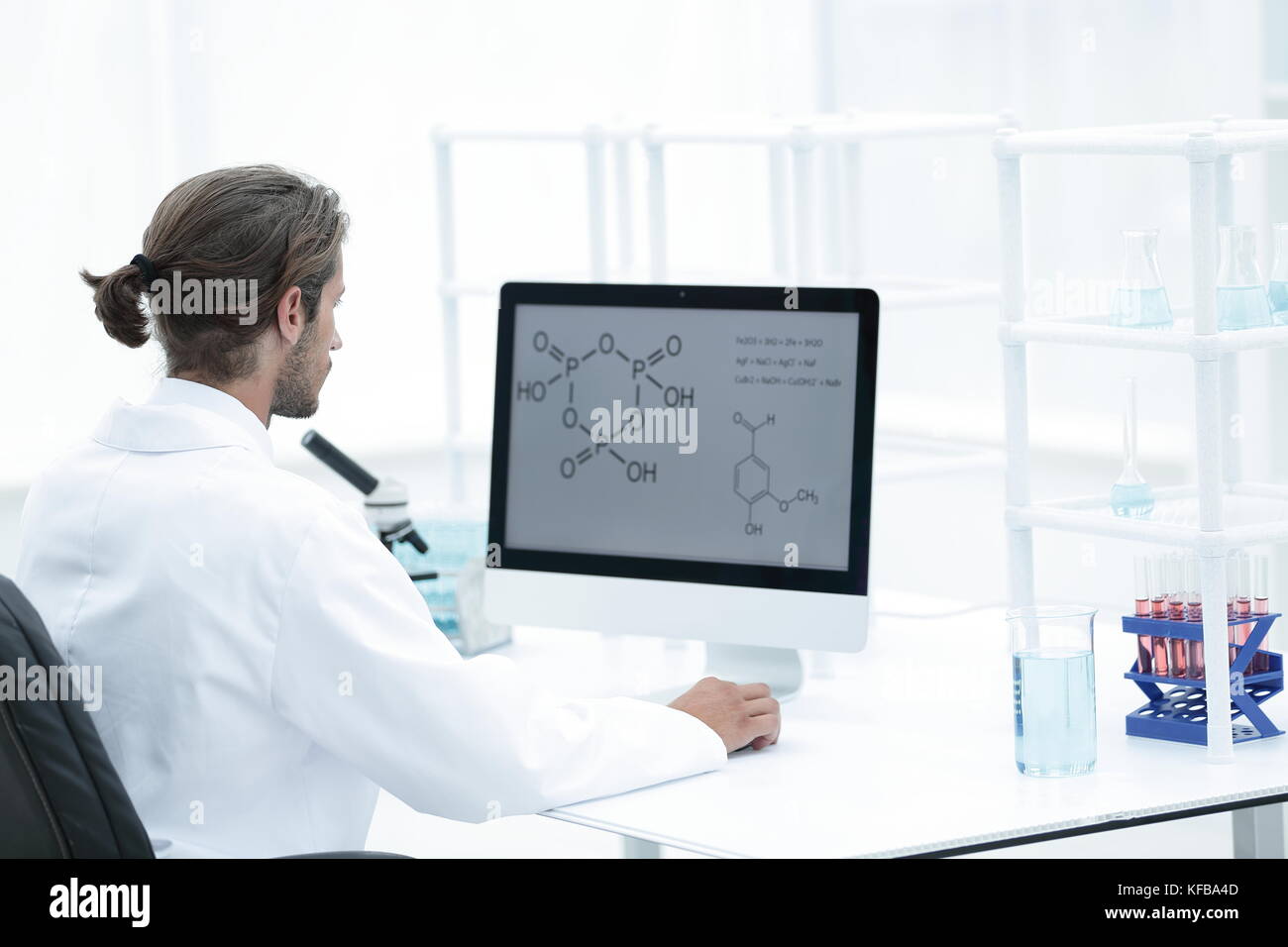 research scientist using computer chemistry laboratory Stock Photo - Alamy