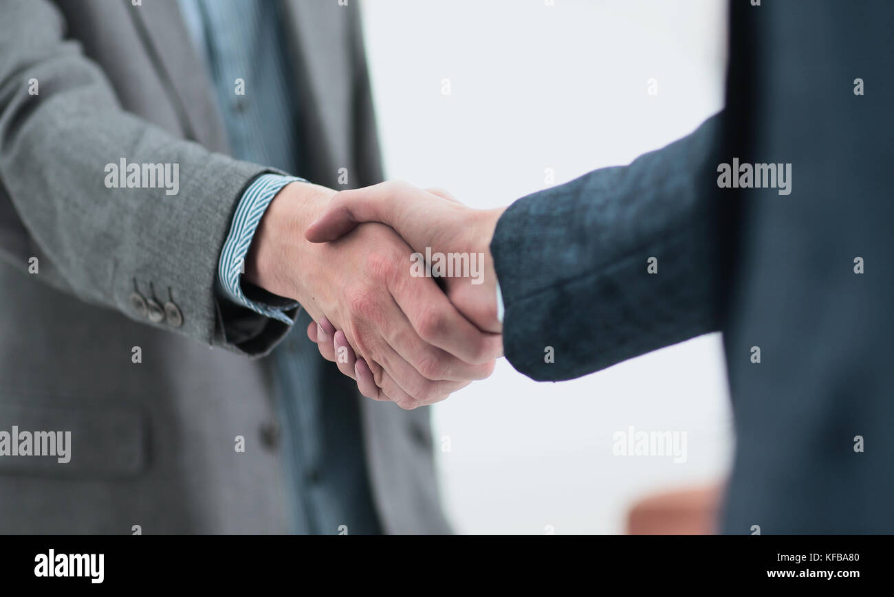 handshake of business partners after discussion of the financial Stock ...