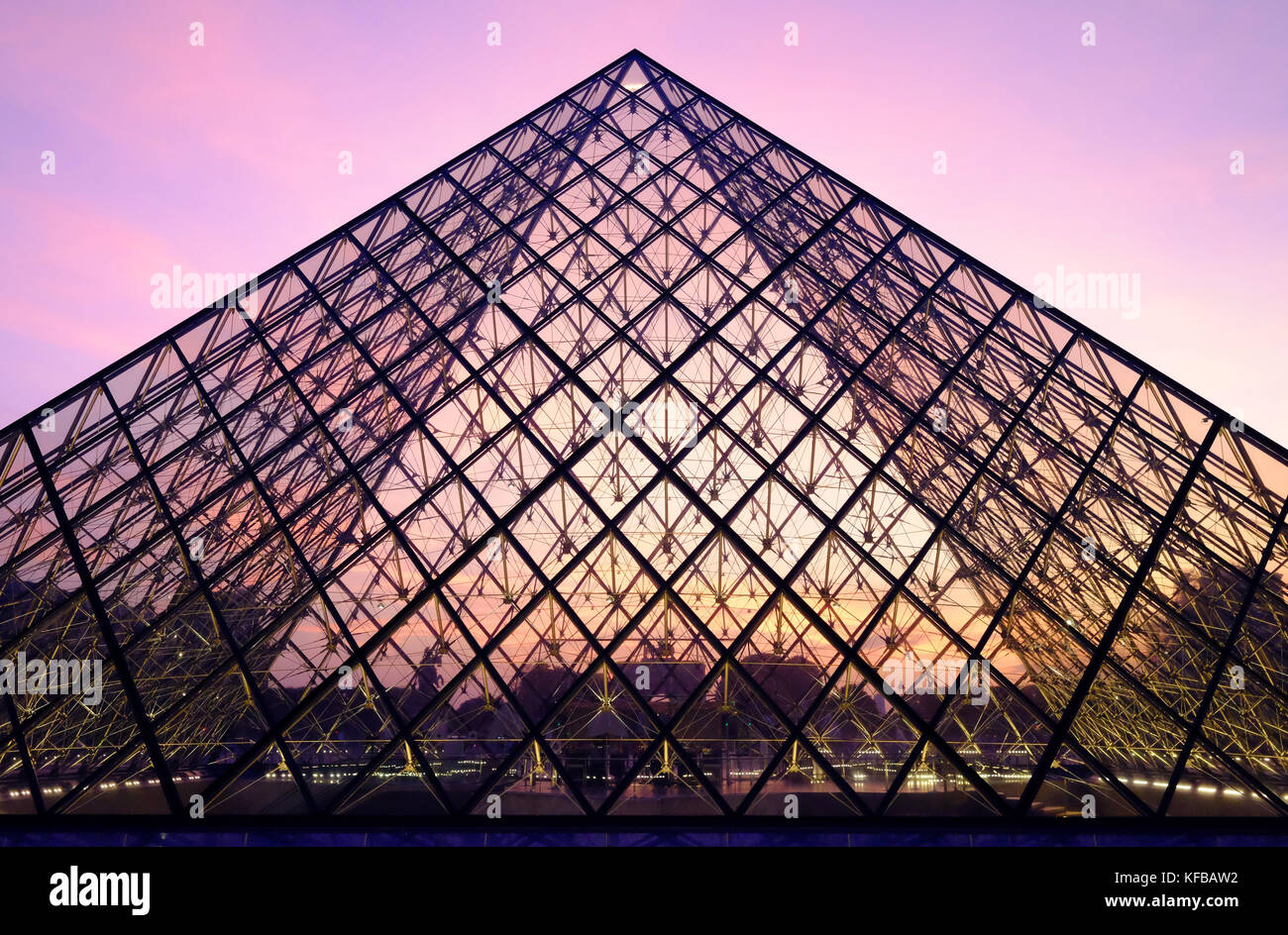 The pyramid of the Louvre in Paris, France at sunset on a summer ...