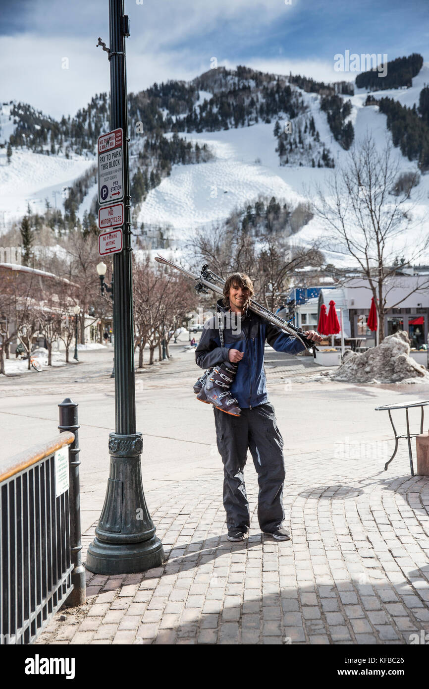 USA, Colorado, Aspen, portrait of a local skier in downtown Aspen, with ...