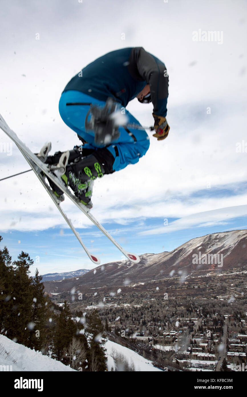USA, Colorado, Aspen, skier getting air on a trail called Corkscrew ...