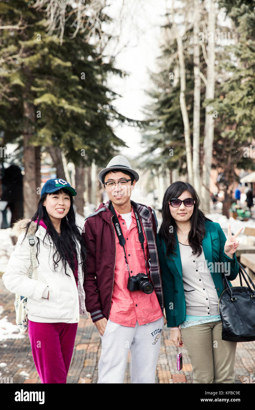 USA, Colorado, Aspen, Japanese tourists on vacation in downtown Aspen ...