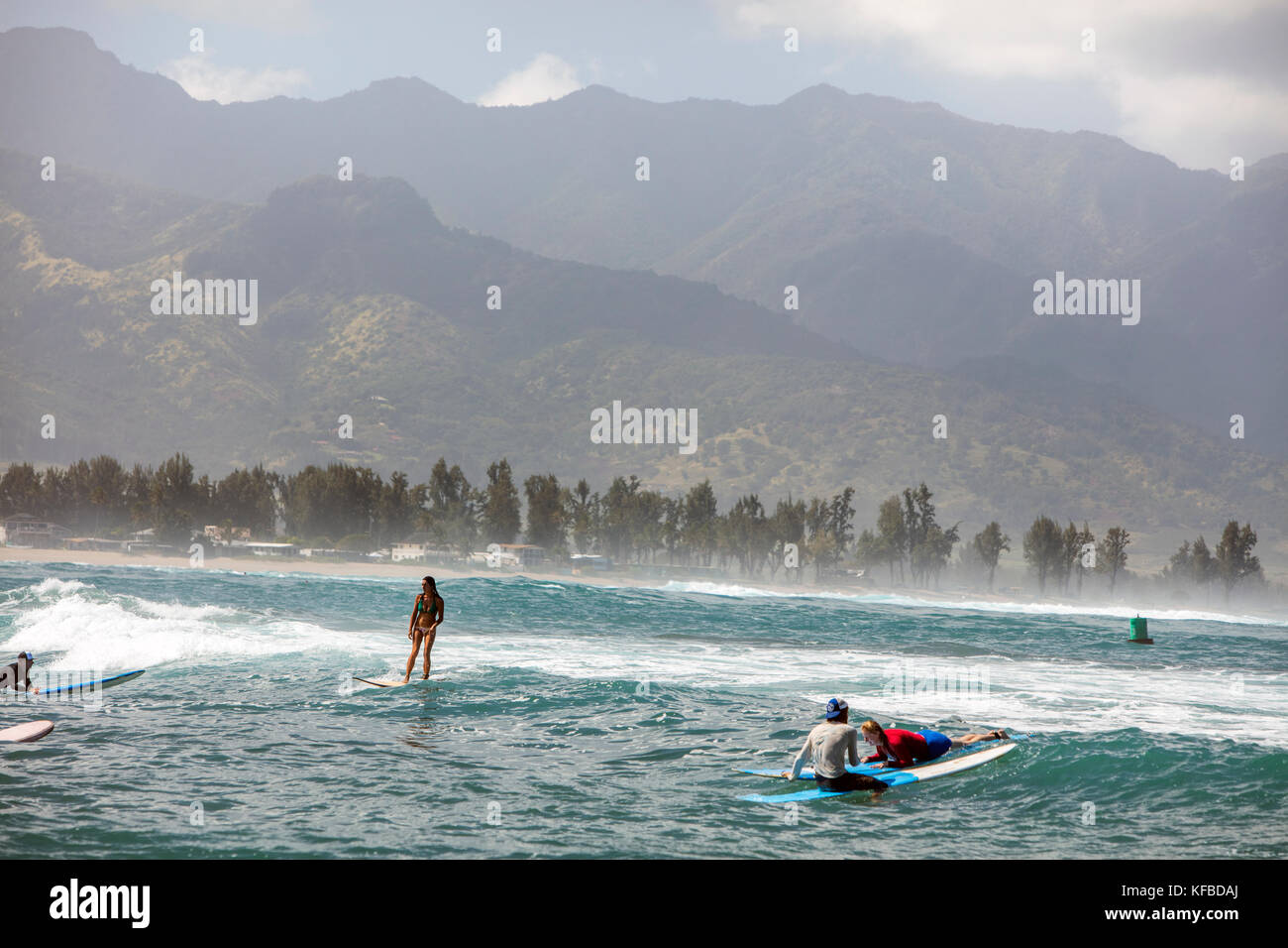 HAWAII, Oahu, North Shore, individuals surfing at Puaena Point Beach ...