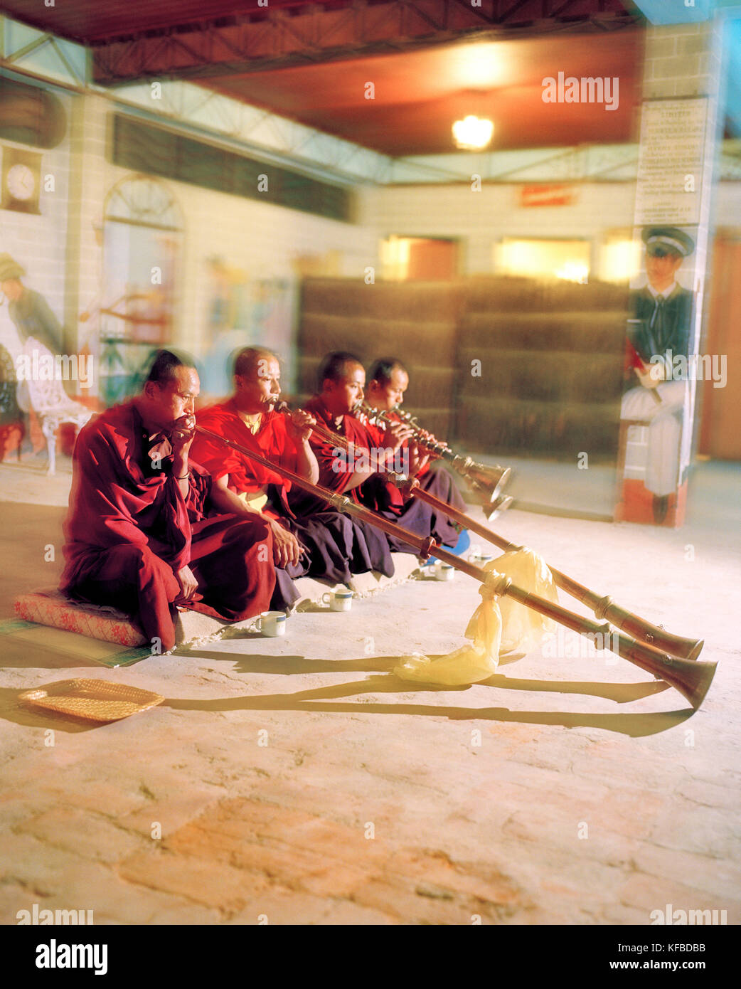 INDIA, West Bengal, monks blowing musical horns, Cochrane Palace ...