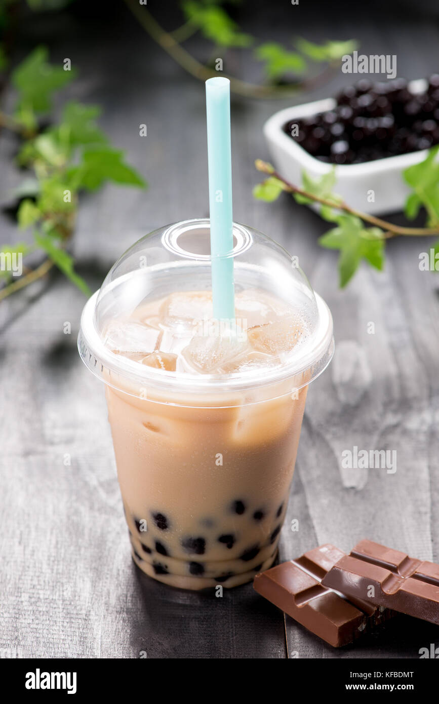 Homemade chocolate milk bubble tea in plastic cups on table Stock Photo ...