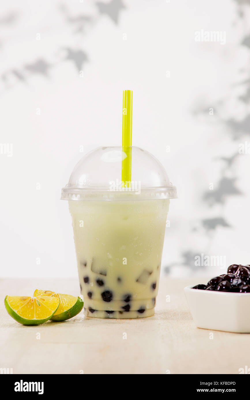 Lemon bubble boba tea with milk and tapioca pearls in plastic cup Stock ...