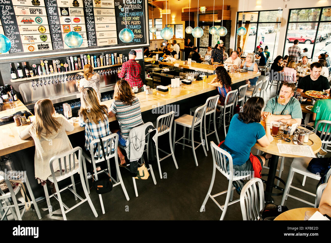 USA, Oregon, Bend, Pacific Pizza and Brew, people enjoying restaurant ...