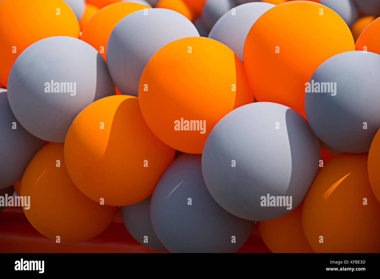 Orange and gray inflatable balls at a celebration activity Stock Photo ...