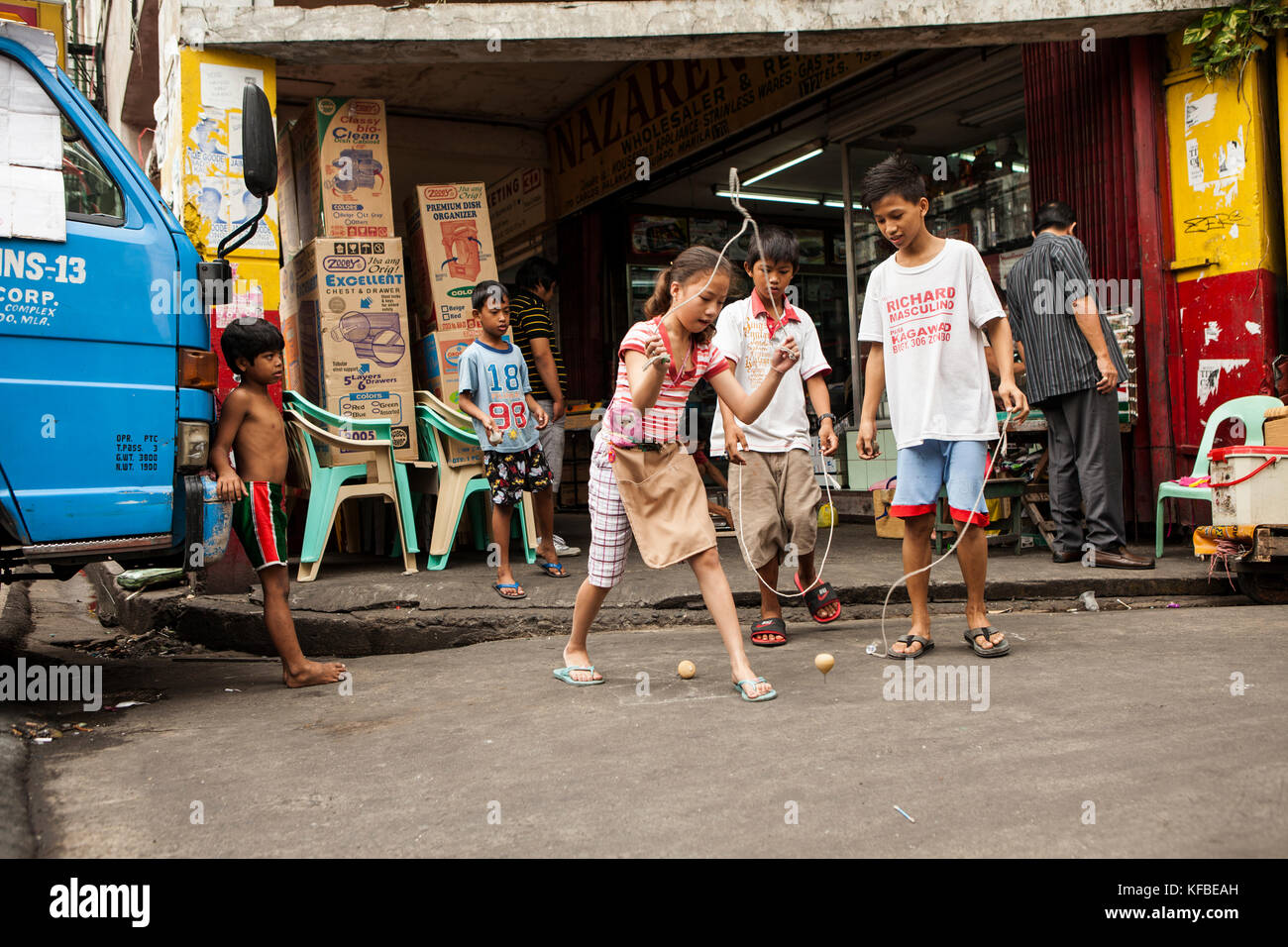 PHILIPPINES, Manila, Qulapo District, kids play in the street at the ...