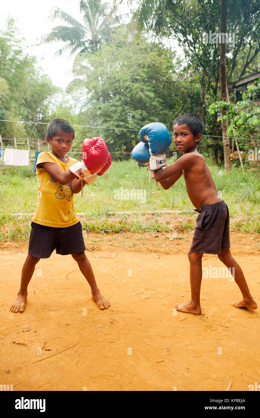 PHILIPPINES, Palawan, Sabang, young boys practice their boxing in the ...