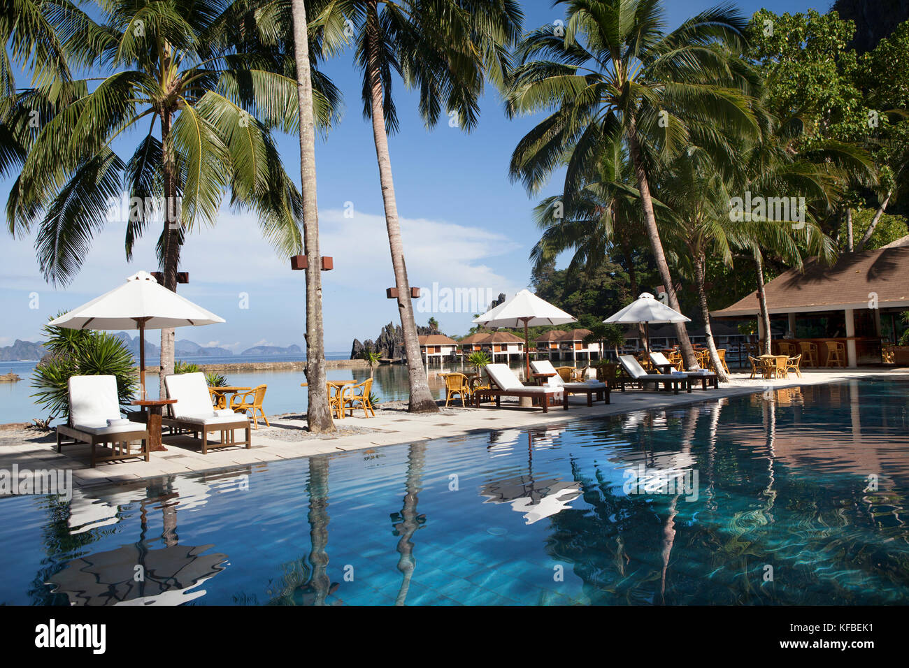 PHILIPPINES, Palawan, El Nido, poolside view at the Lagen Island resort ...