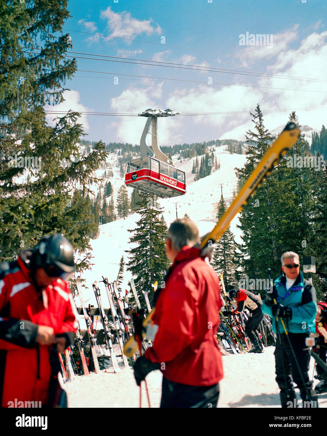 USA, Utah, a man watches the tram at the Snowbird Ski Resort base Stock ...