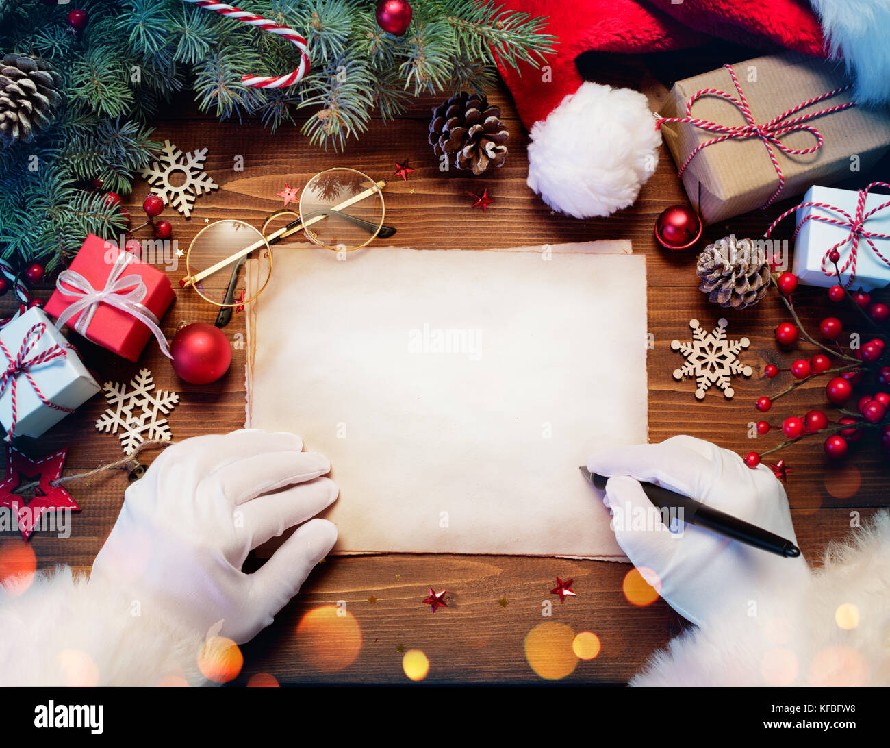 Santa Claus Desk With Letter And Christmas Present Stock Photo - Alamy