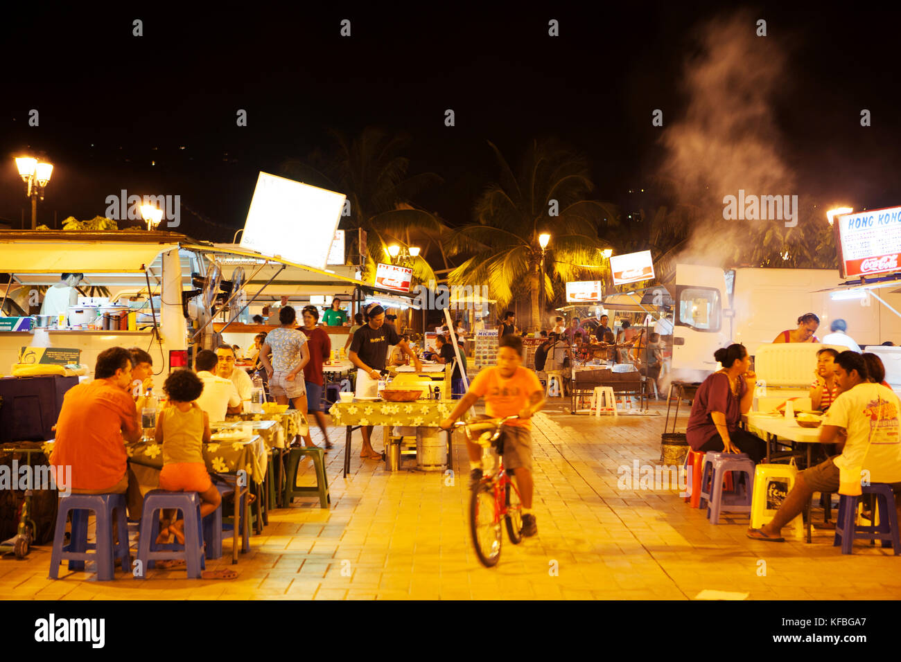 FRENCH POLYNESIA, Tahiti. Roulotte Food Trucks at night at the dock in ...