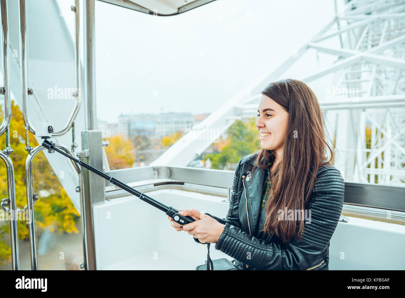 happy woman taking a selfie in ferris wheel Stock Photo - Alamy