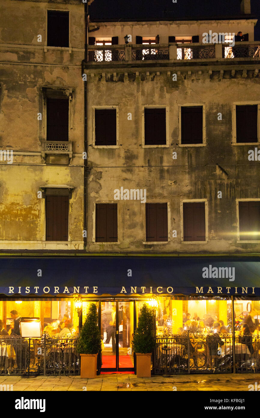 ITALY, Venice. View of diners at Ristorante Antico Martini at night ...