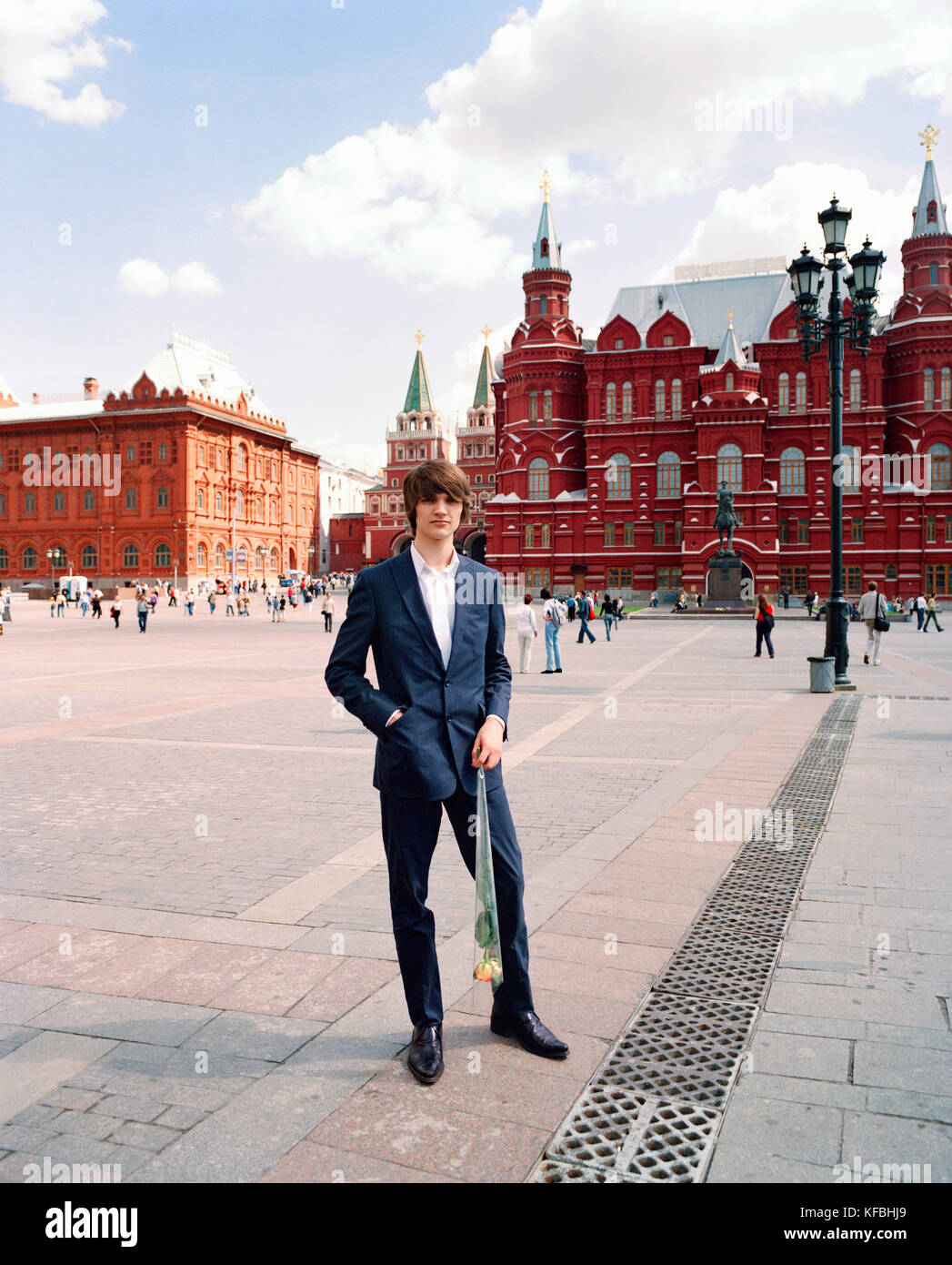 RUSSIA, Moscow, Kremlin, young man posing with people in the background ...
