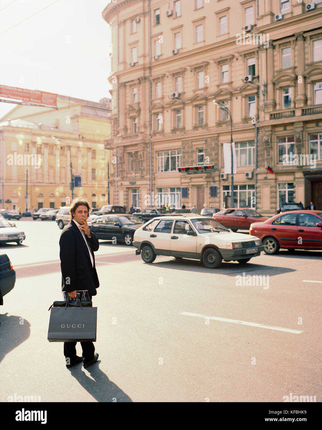 RUSSIA, Moscow, mid adult man with shopping bag smoking on street Stock ...
