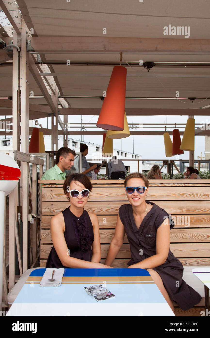 RUSSIA, Moscow. Friends having lunch at the roof restaurant at Bar ...
