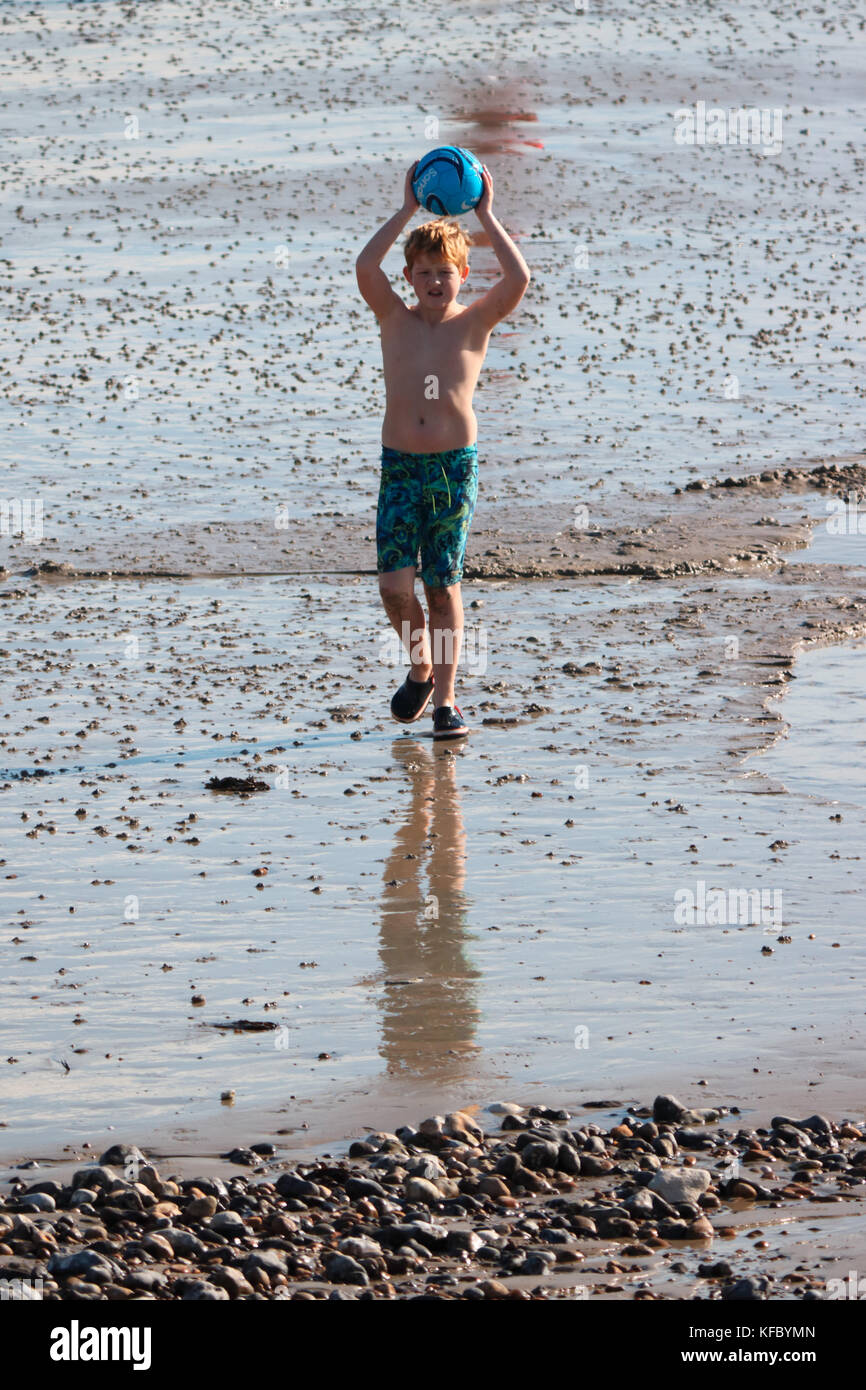 Goring Beach, West Sussex, UK. 27th October 2017. A boy plays on the ...