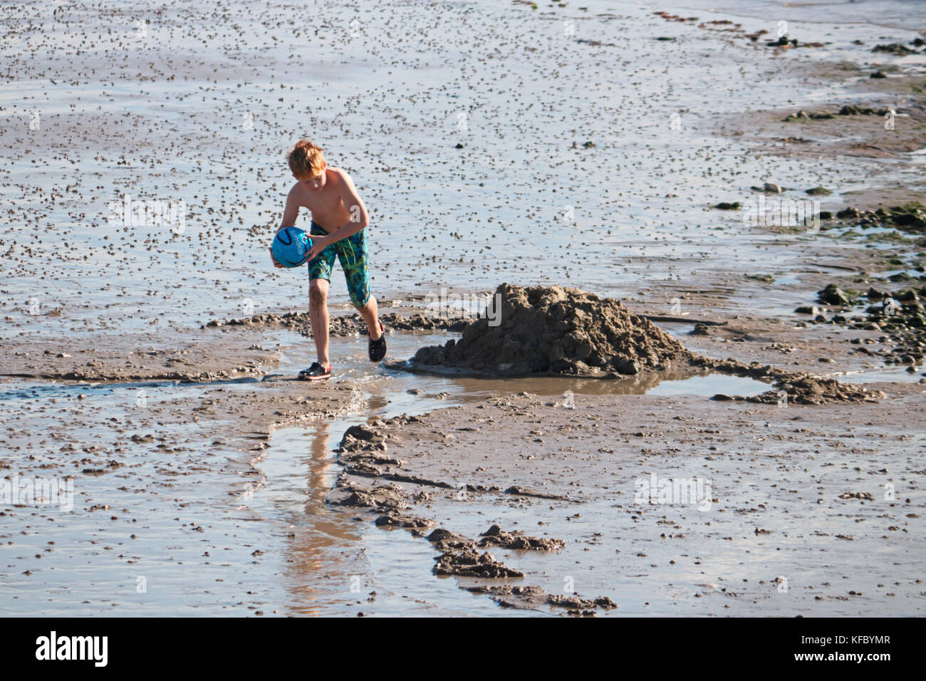 Goring Beach, West Sussex, UK. 27th October 2017. A boy plays on the ...