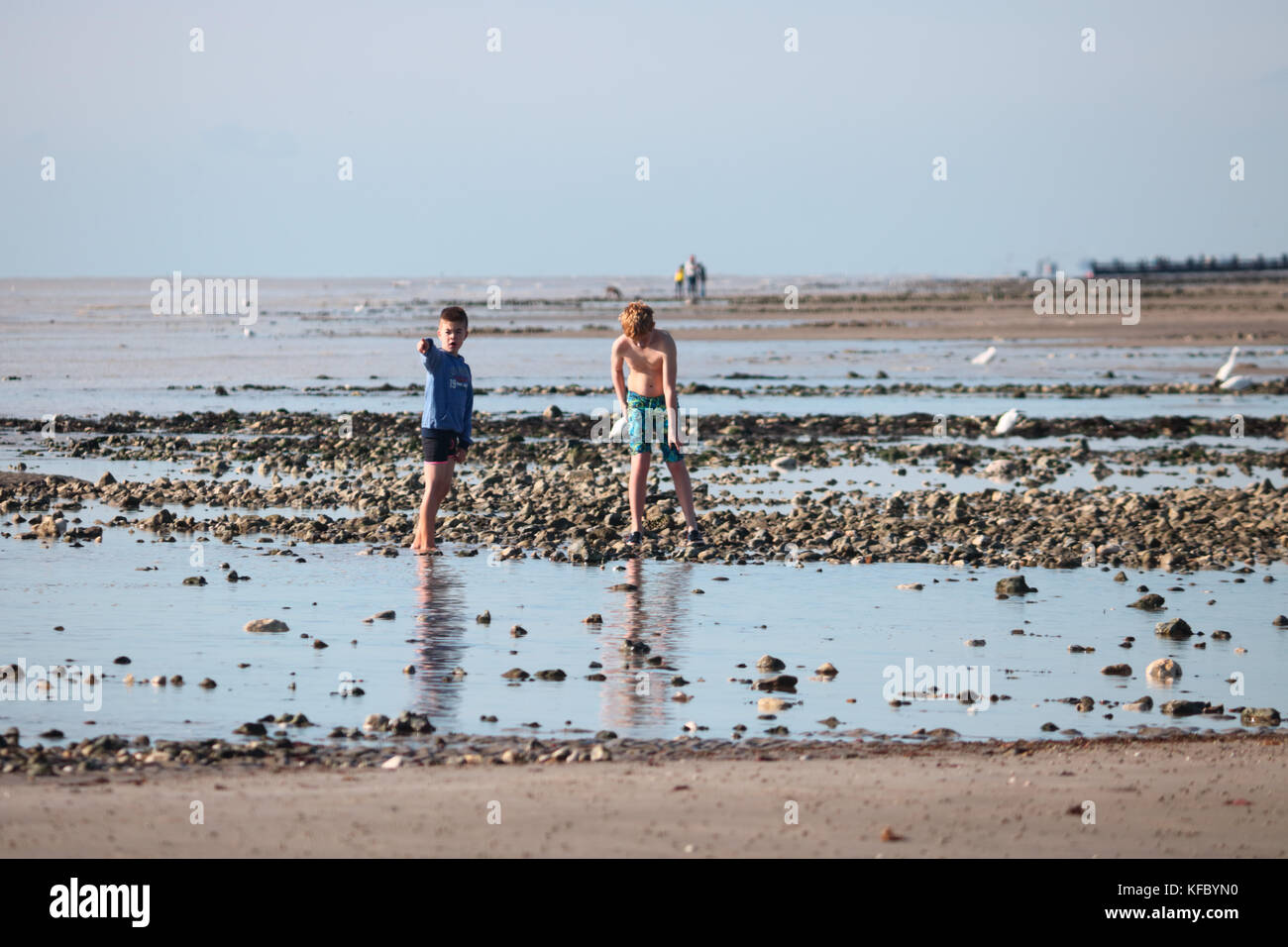 Goring Beach, West Sussex, UK. 27th October 2017. Two boys playing on ...