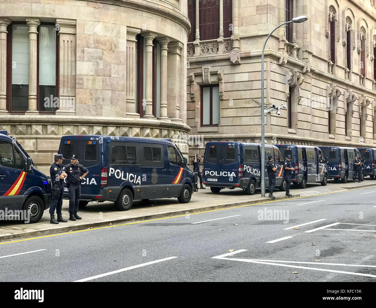 Police officers in Barcelona stand ready to act after Catalonia ...