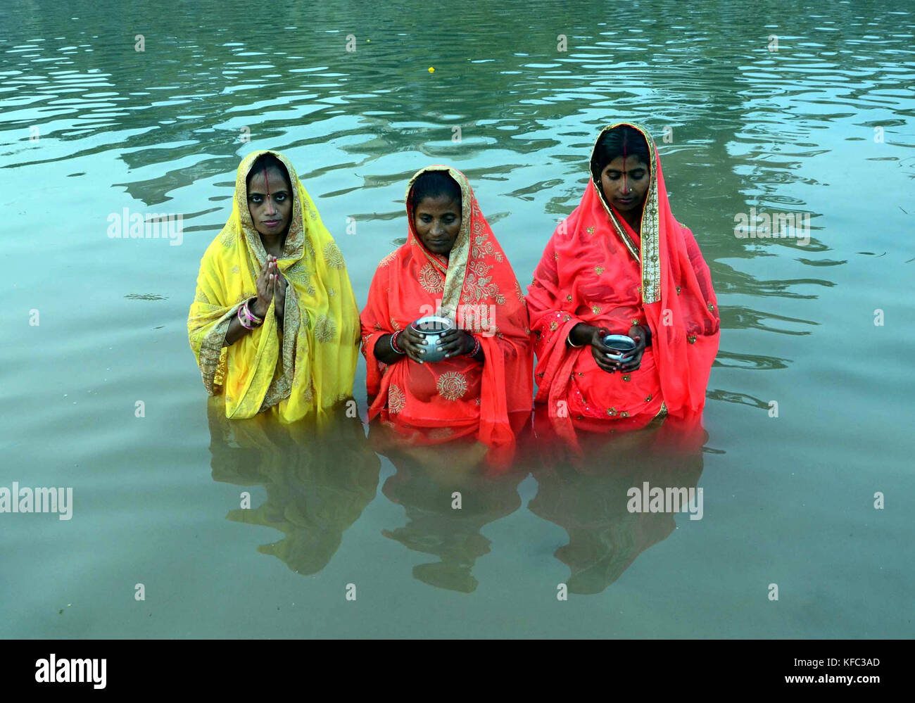 Jammu, India. 26th Oct, 2017. An Indian devotee receives a Tika, a red ...