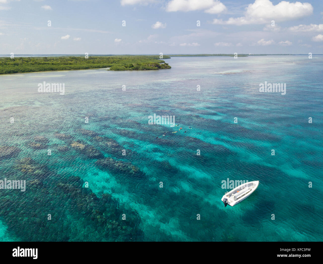An aerial view of a beautiful coral reef on the edge of Turneffe Atoll ...