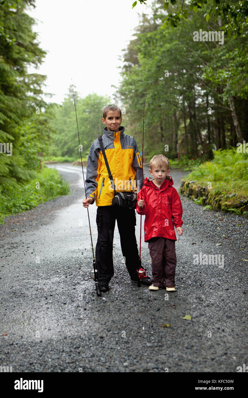 USA, Alaska, Sitka, Daniel and Joshua fish with their grandfather at ...