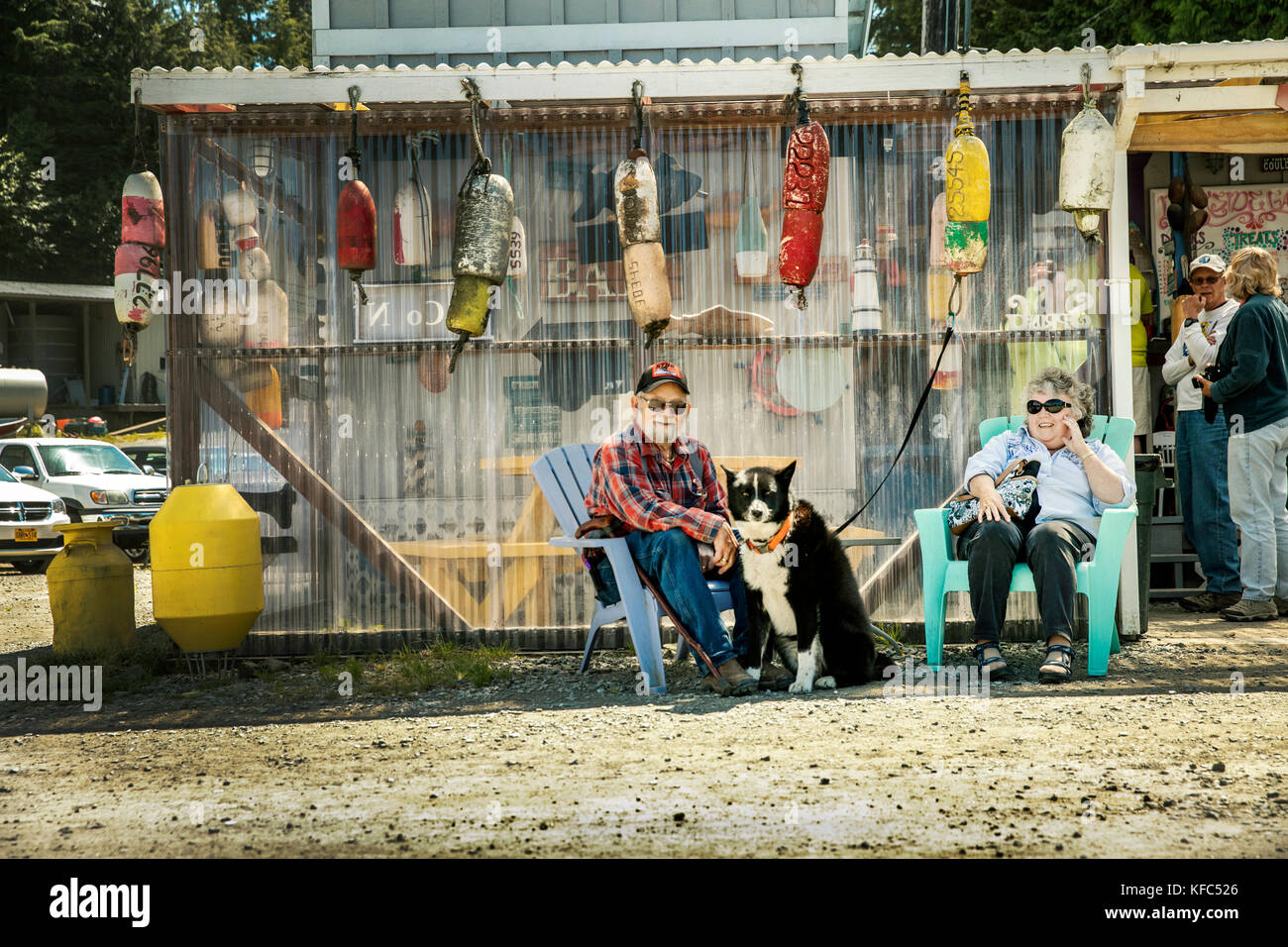 USA, Alaska, Ketchikan, a couple sits outside of Dockside Galley ...