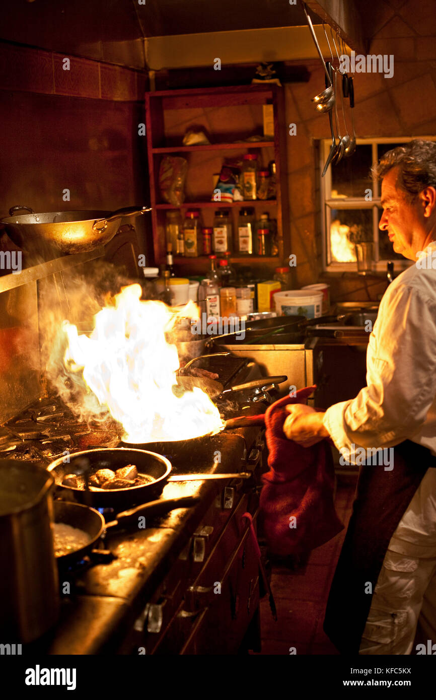 BELIZE, Hopkins, Chef Rob prepares an entree at his restaurant, Chef ...