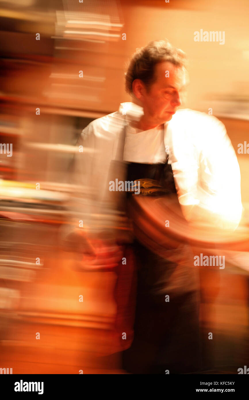 BELIZE, Hopkins, Chef Rob prepares an entree at his restaurant, Chef ...