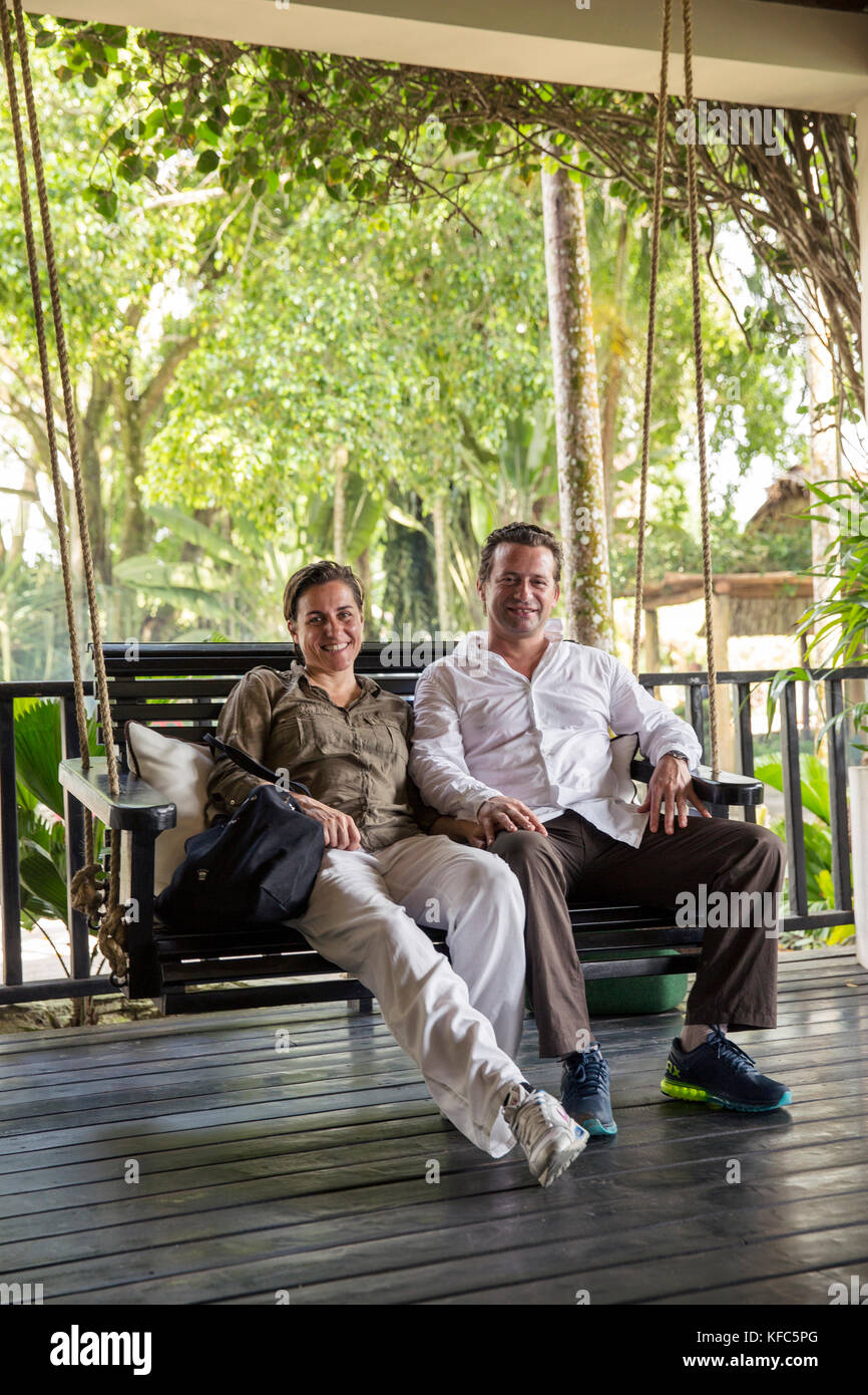 BELIZE, Punta Gorda, Toledo, guests sit and enjoy a hanging swing ...