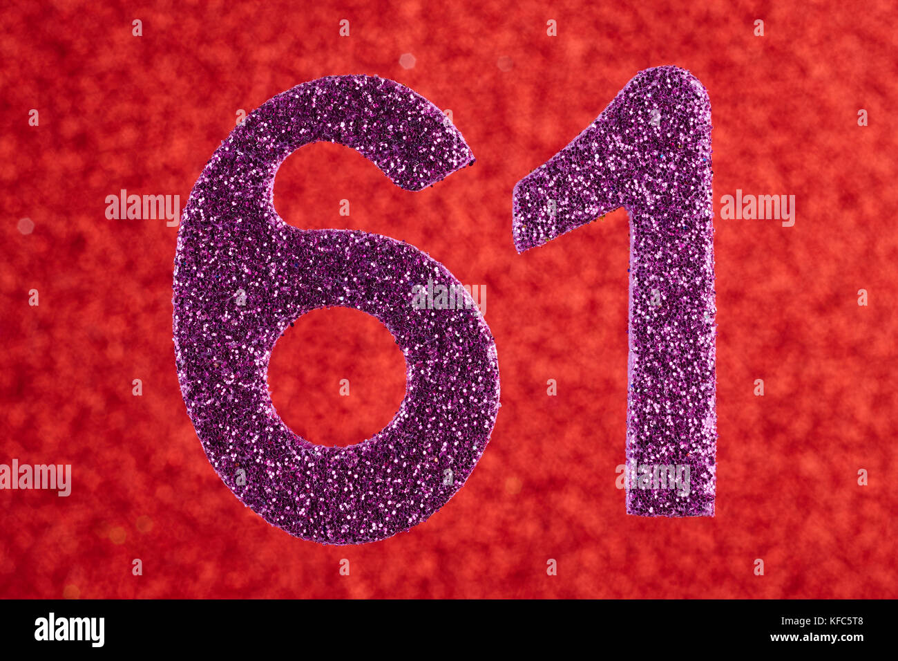 Number sixty-one purple color over a red background. Anniversary ...