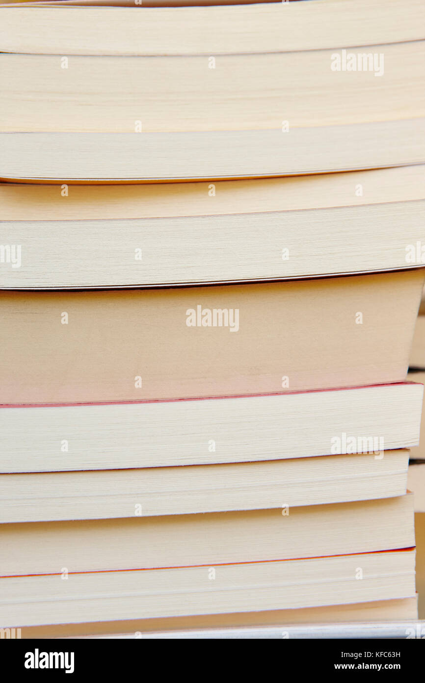 Stacked books. White pages background. School education. Vertical Stock ...