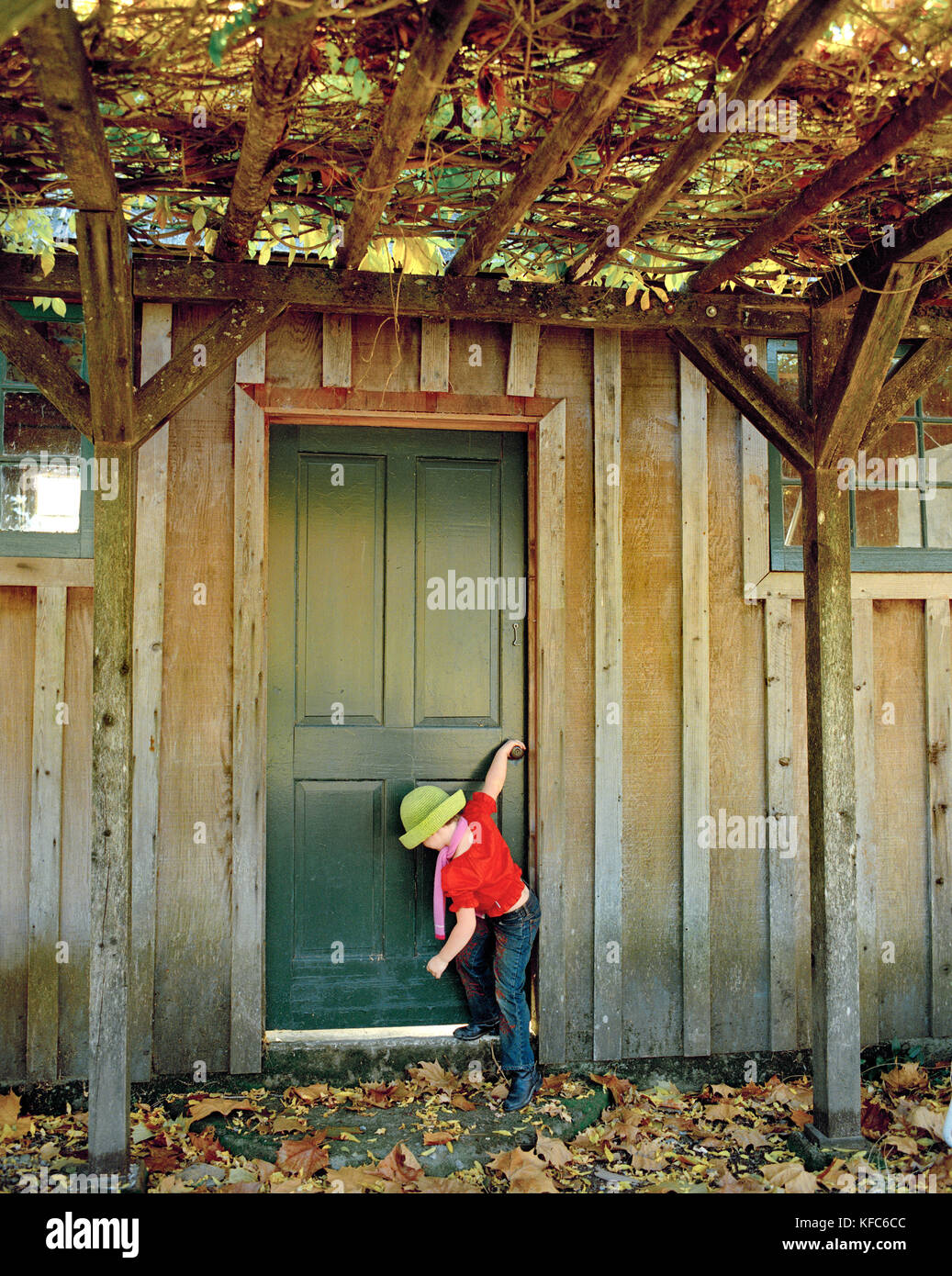 USA, California, girl closing a door in the Fall Stock Photo - Alamy