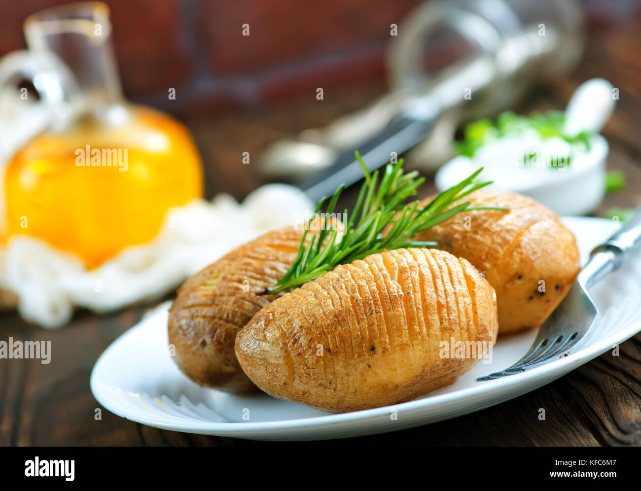 baked potato on plate and on a table Stock Photo - Alamy