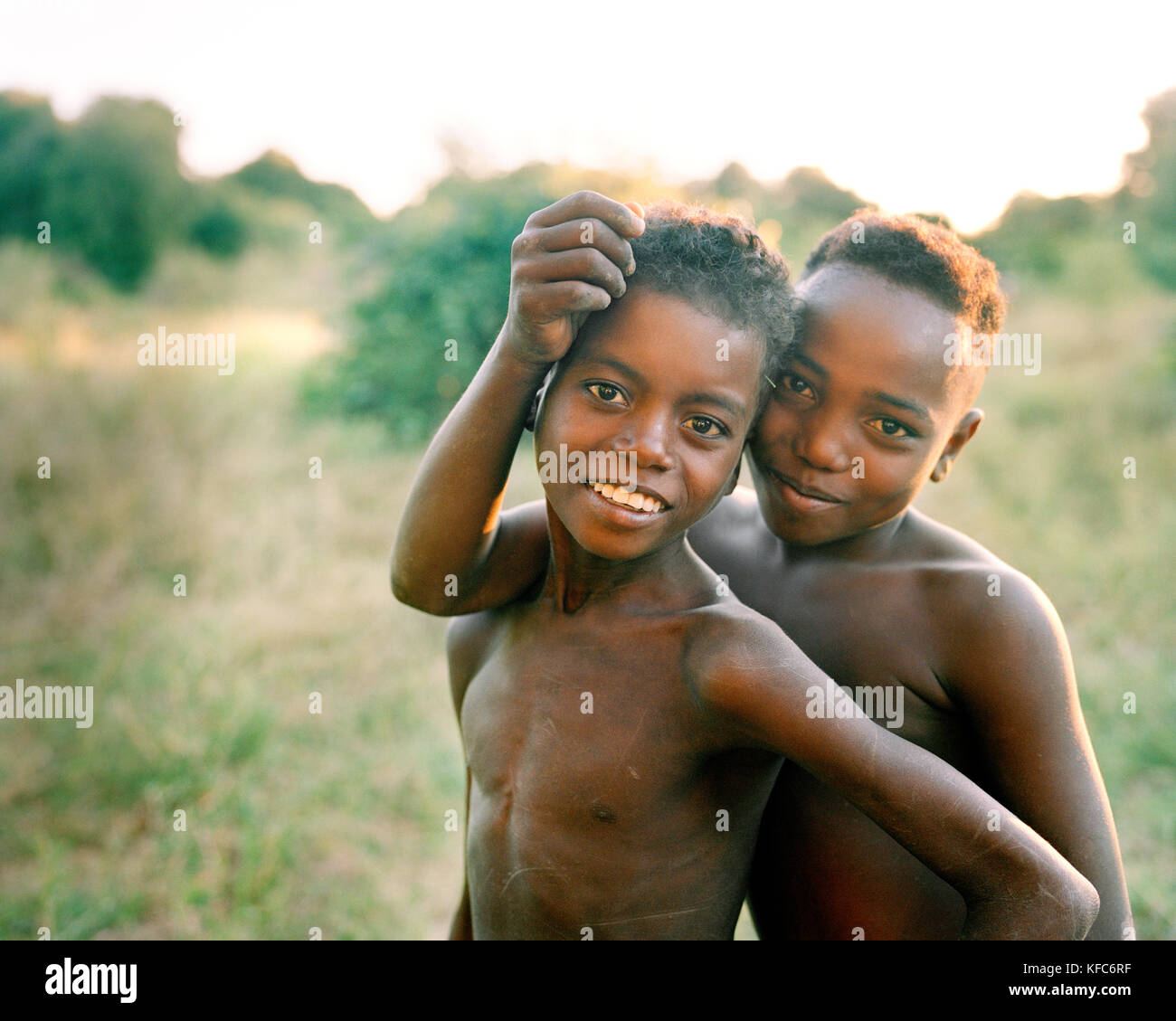 MADAGASCAR, two shirtless Mahafaly boys smiling, portrait, Mahazoarivo ...