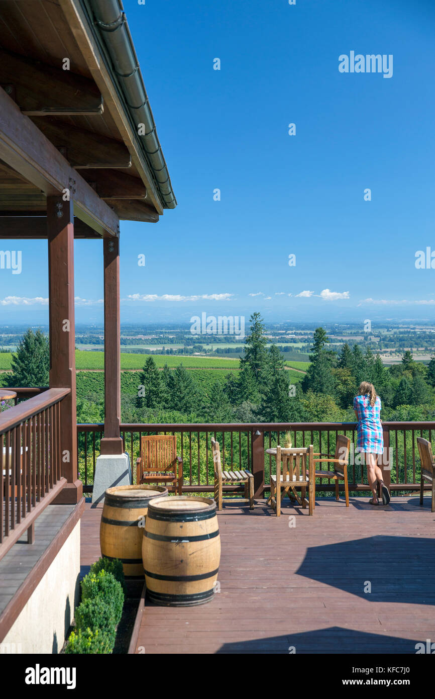 USA, Oregon, Willamette Valley, a young woman takes in the view of the ...