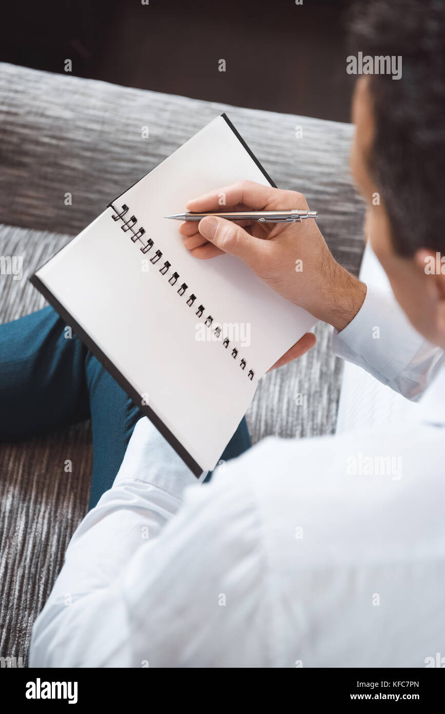Man writing in diary cropped hi-res stock photography and images - Alamy