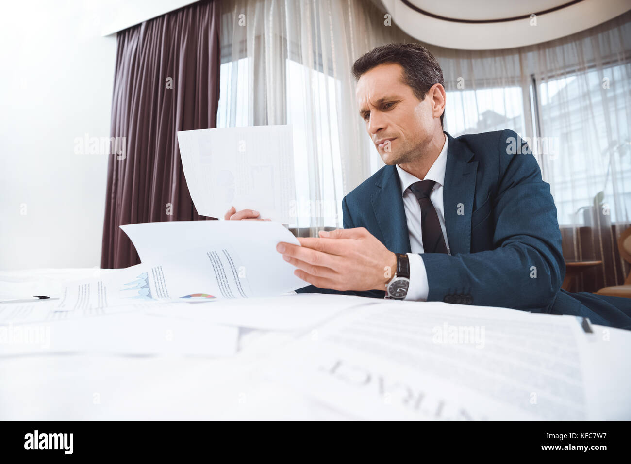 Reading paperwork hi-res stock photography and images - Alamy