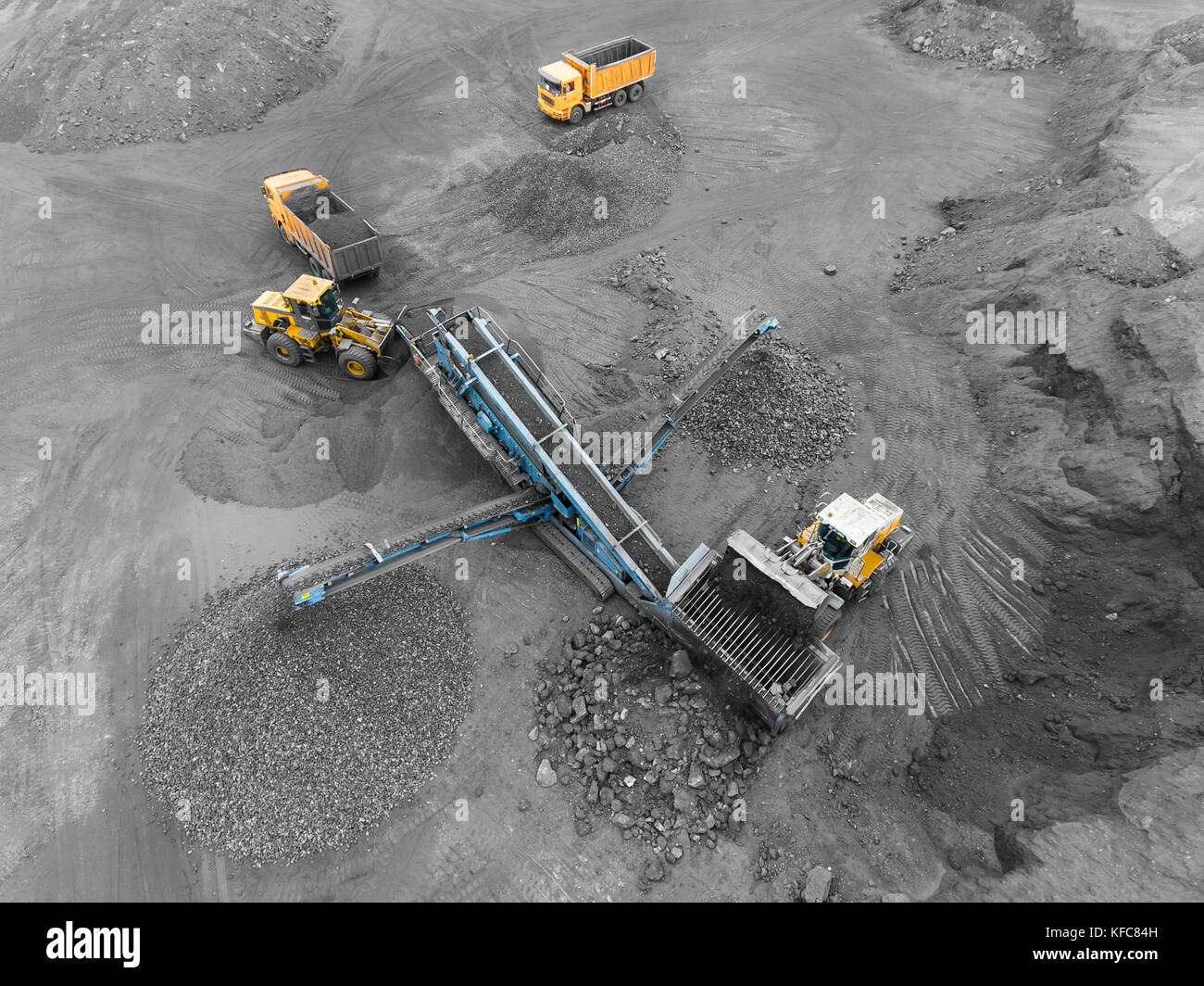 Open pit mine, breed sorting. Mining coal. Bulldozer sorts coal ...
